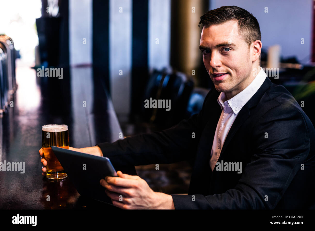 Thoughtful businessman drinking glass beer hi-res stock photography and ...