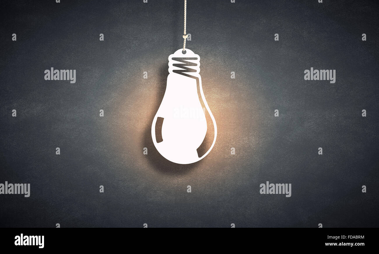 Glowing light bulb on dark background hanging from above Stock Photo ...