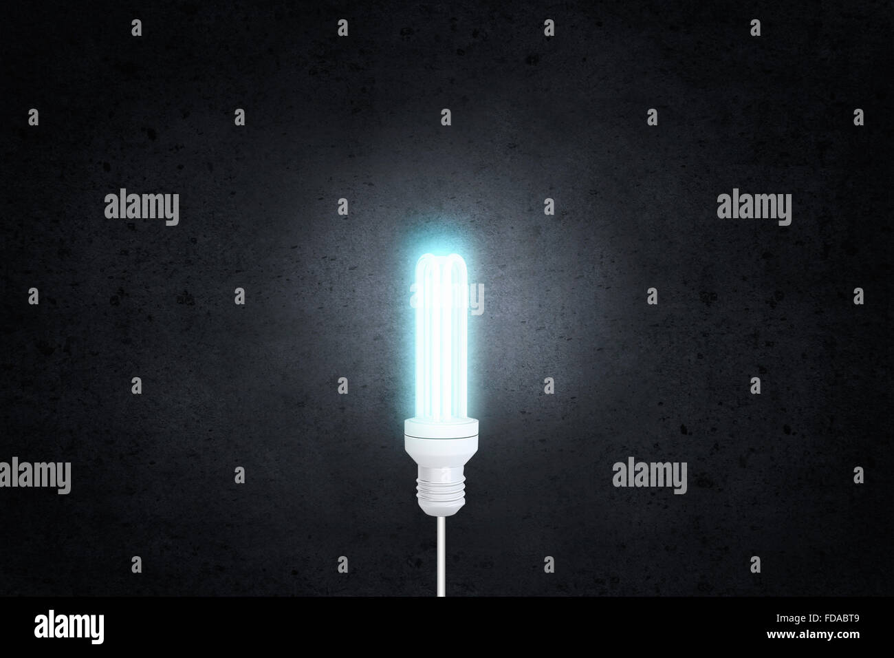 Glowing inverted light bulb on dark background Stock Photo - Alamy