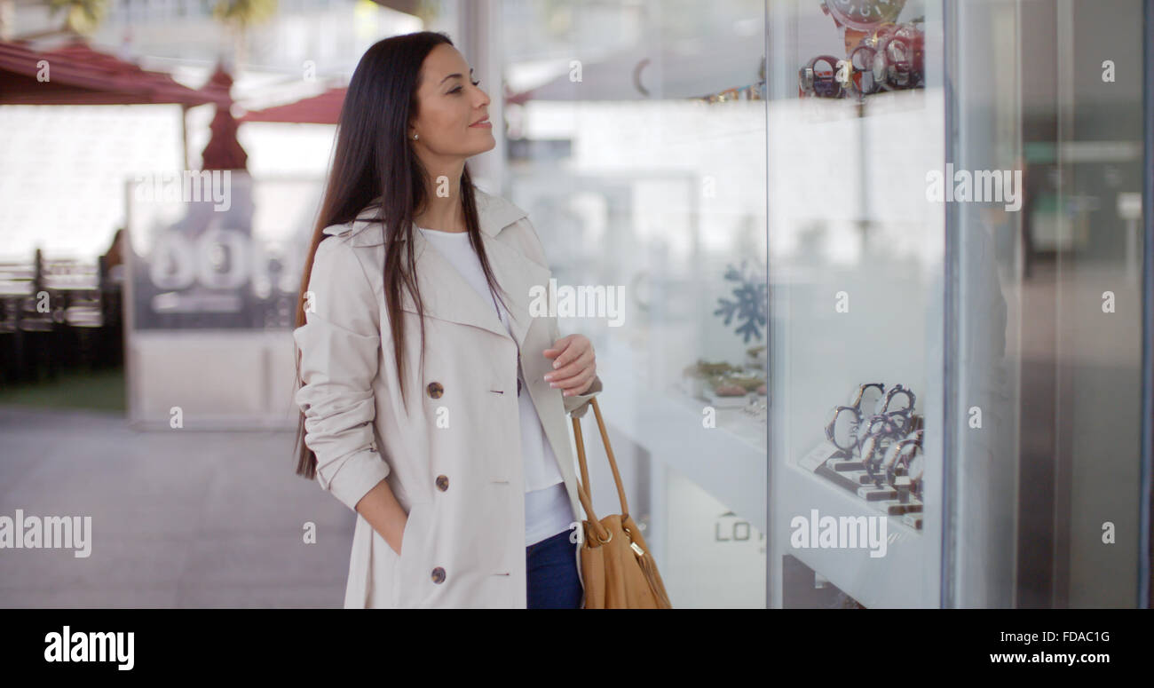 Stylish young woman browsing in a shopping mall Stock Photo - Alamy