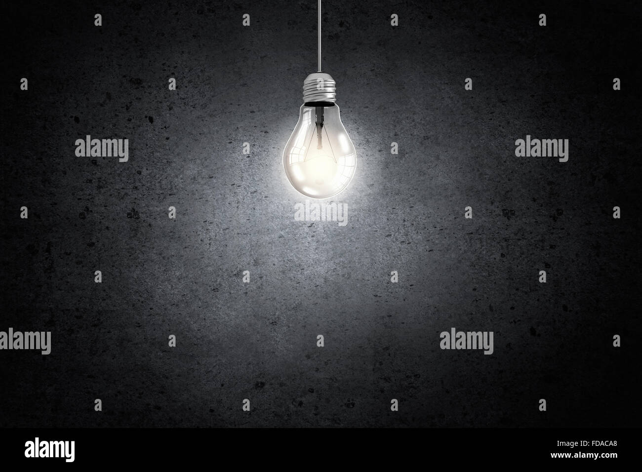Glowing light bulb on dark background hanging from above Stock Photo ...