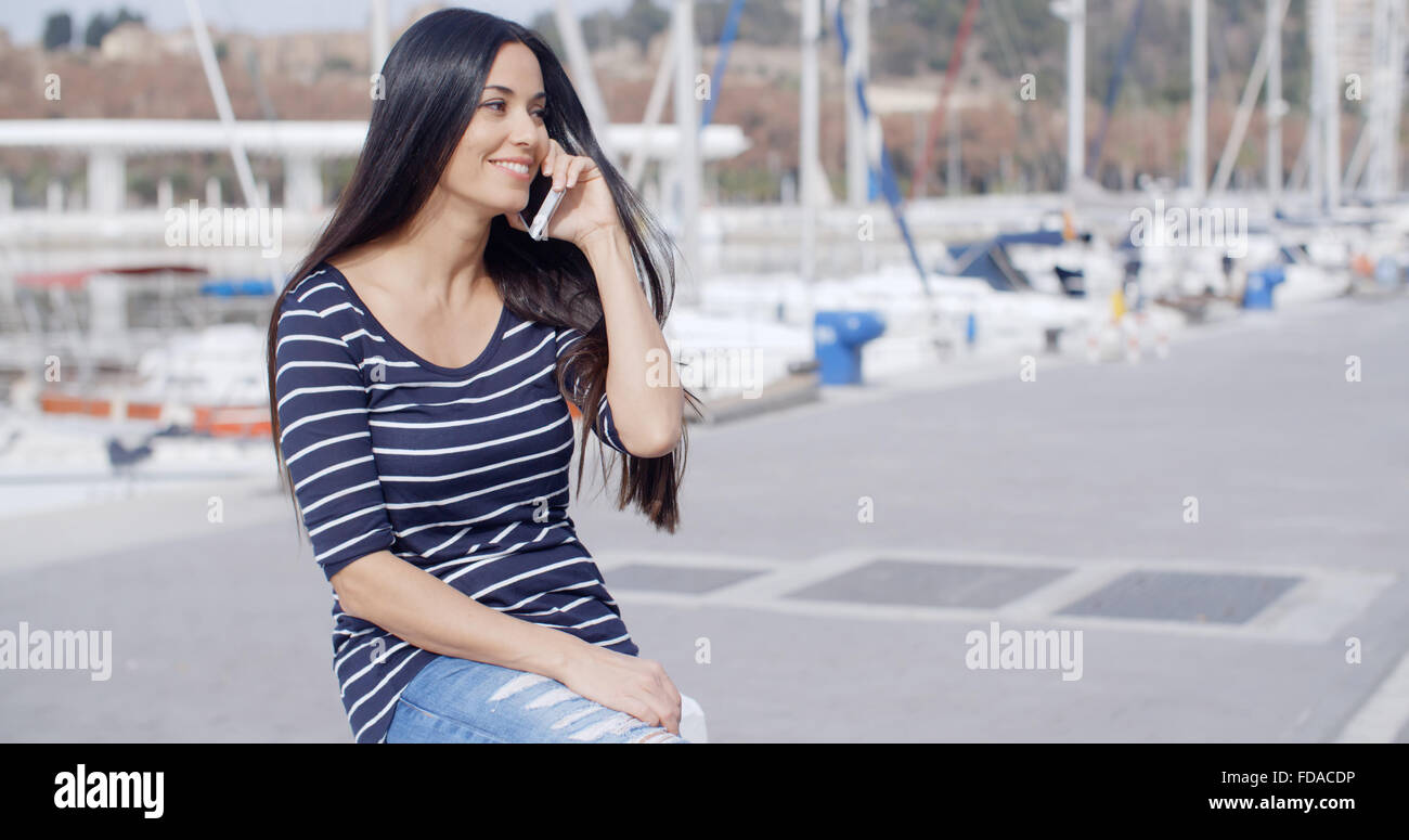 Young woman on a seafront promenade Stock Photo - Alamy