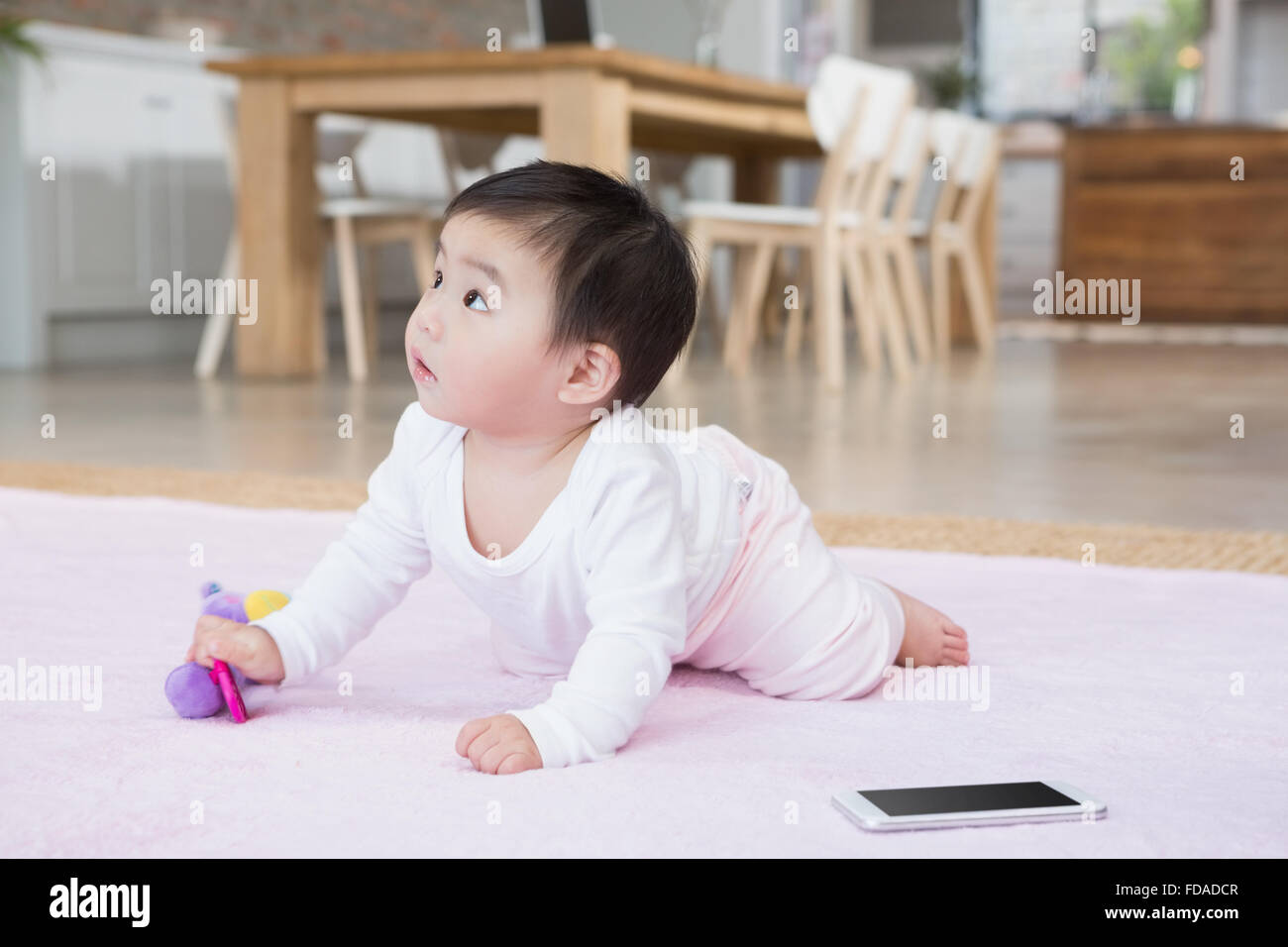 Cute baby on the carpet Stock Photo - Alamy