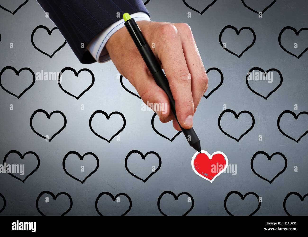 Male hand drawing red heart with marker Stock Photo - Alamy