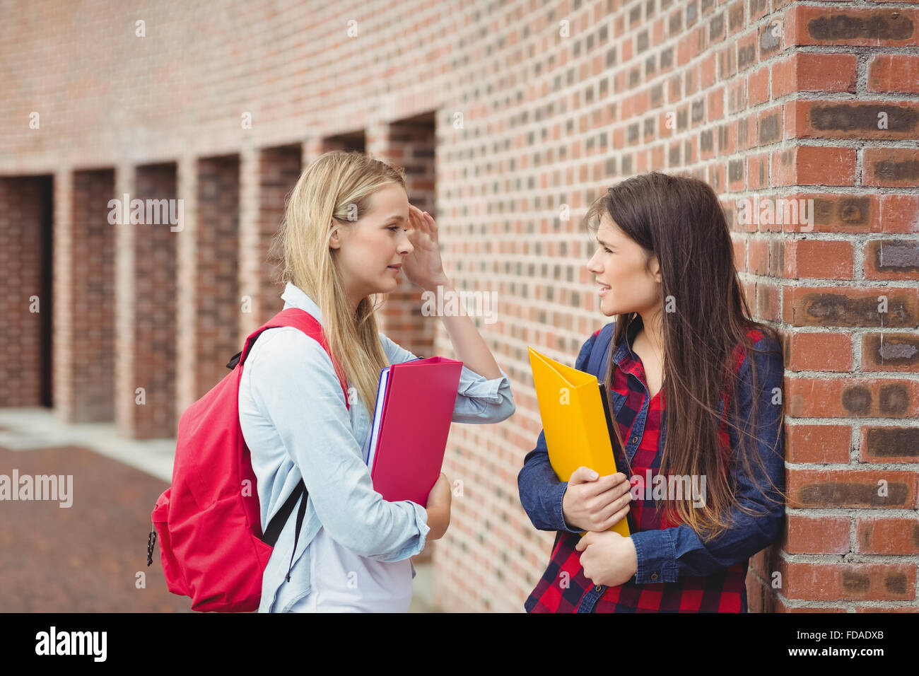 Smiling students talking outdoor Stock Photo - Alamy