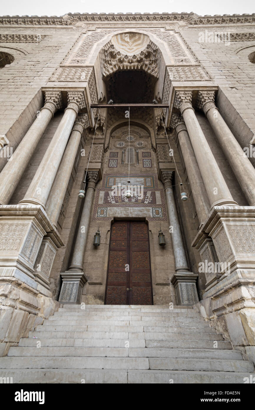 Entrance leading to a historic mosque with Stairs and wooden closed ...