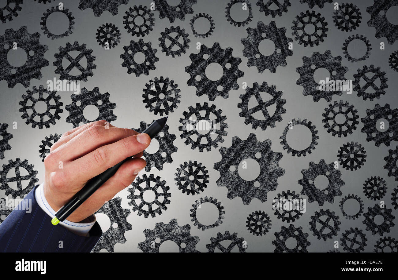 Close up of hand drawing gears mechanism with marker Stock Photo - Alamy