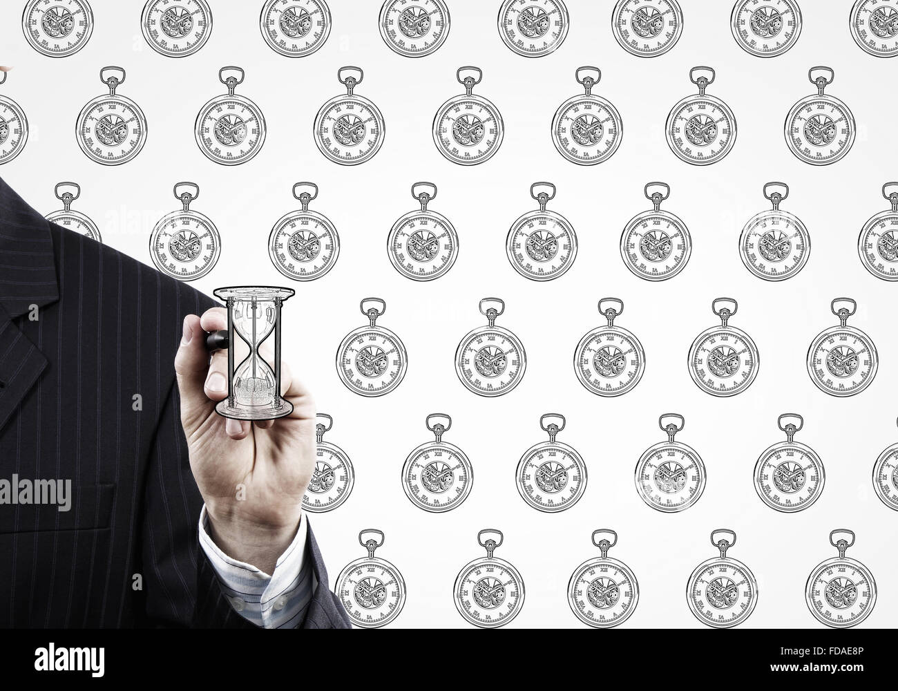 Close up of male hand drawing sandglass Stock Photo - Alamy