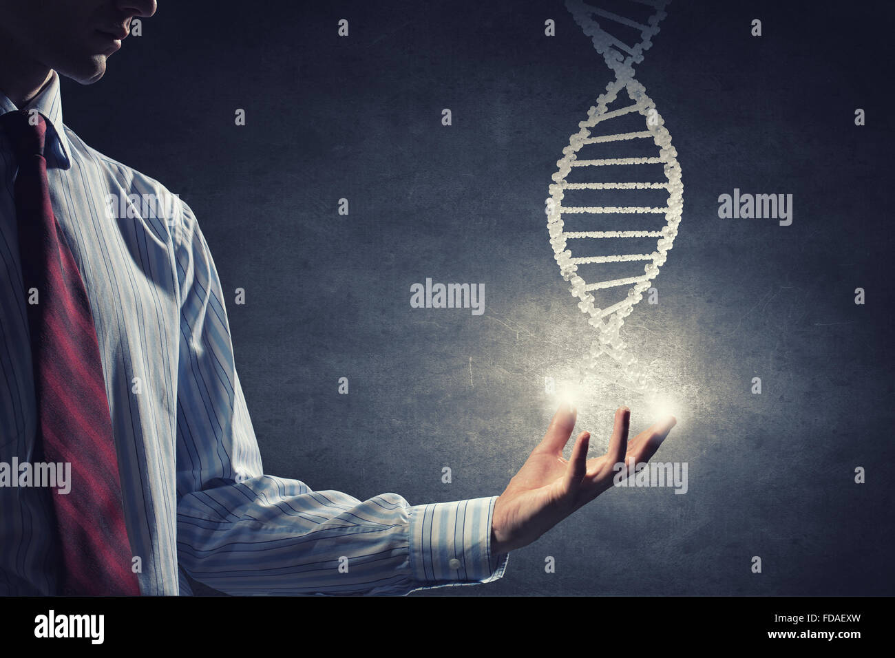 Close up of male hand holding DNA molecule in palm Stock Photo - Alamy