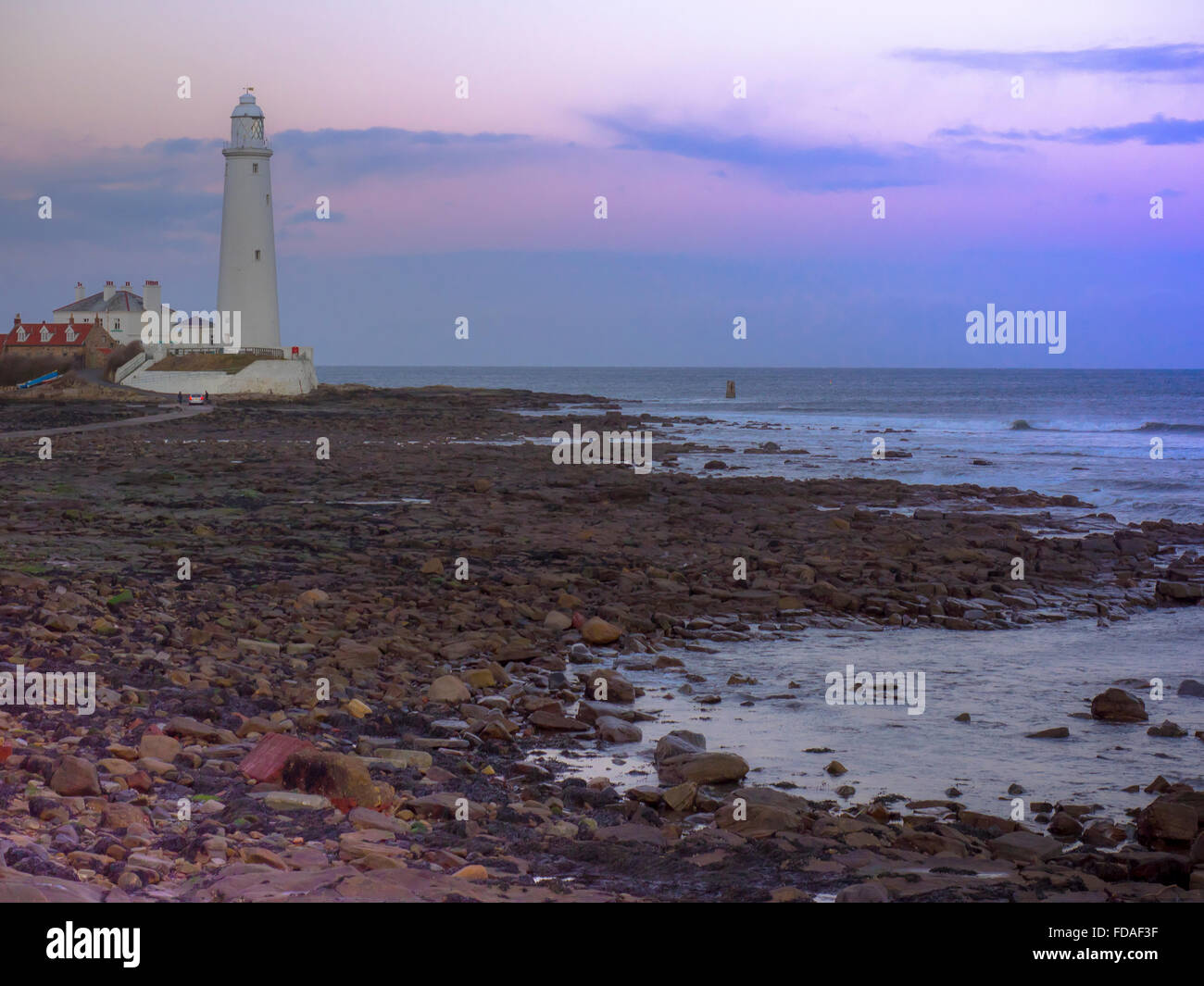 Lighthouse at dusk Stock Photo - Alamy
