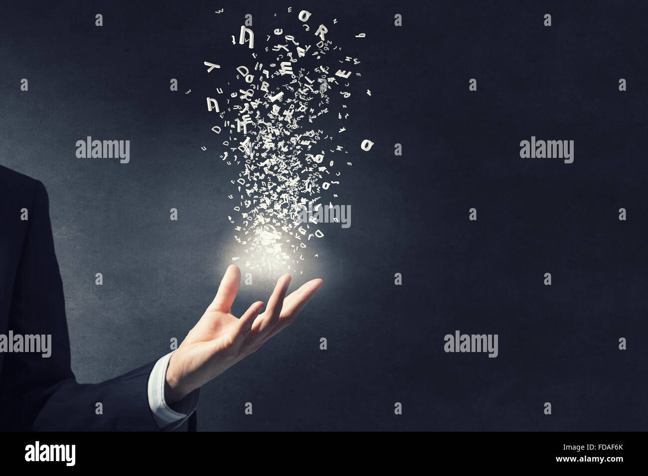 Close up of male hand and characters flying of palm Stock Photo - Alamy