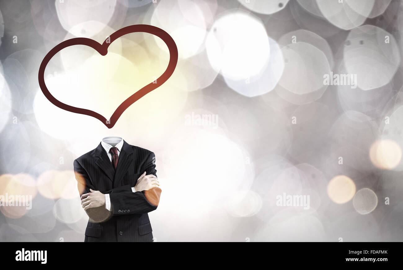 Faceless businessman with heart instead of head Stock Photo - Alamy