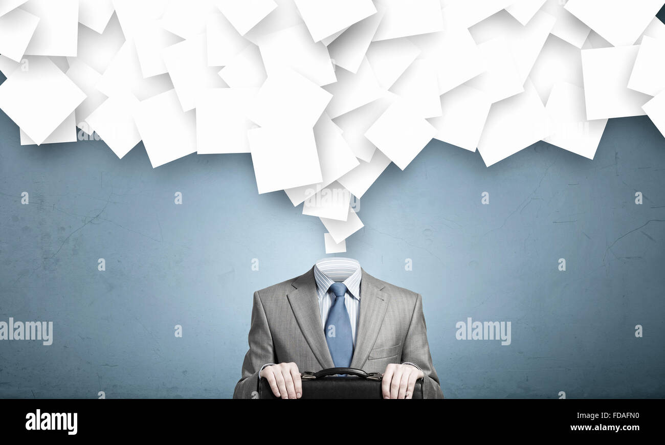 Faceless businessman and many papers instead of his head Stock Photo ...