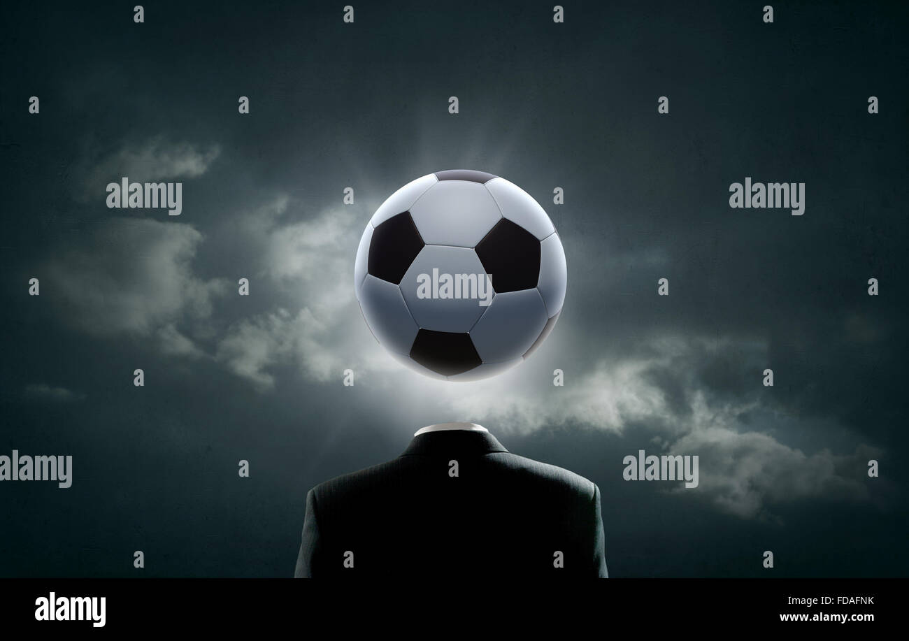 Unrecognizable man with soccer ball instead of head Stock Photo - Alamy