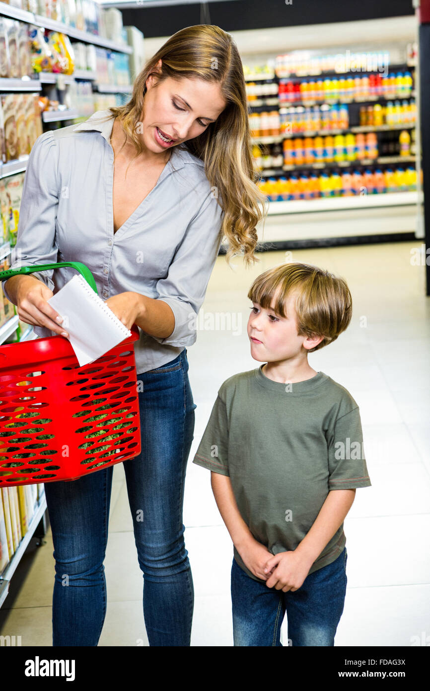 Mother and son reading shopping list Stock Photo - Alamy