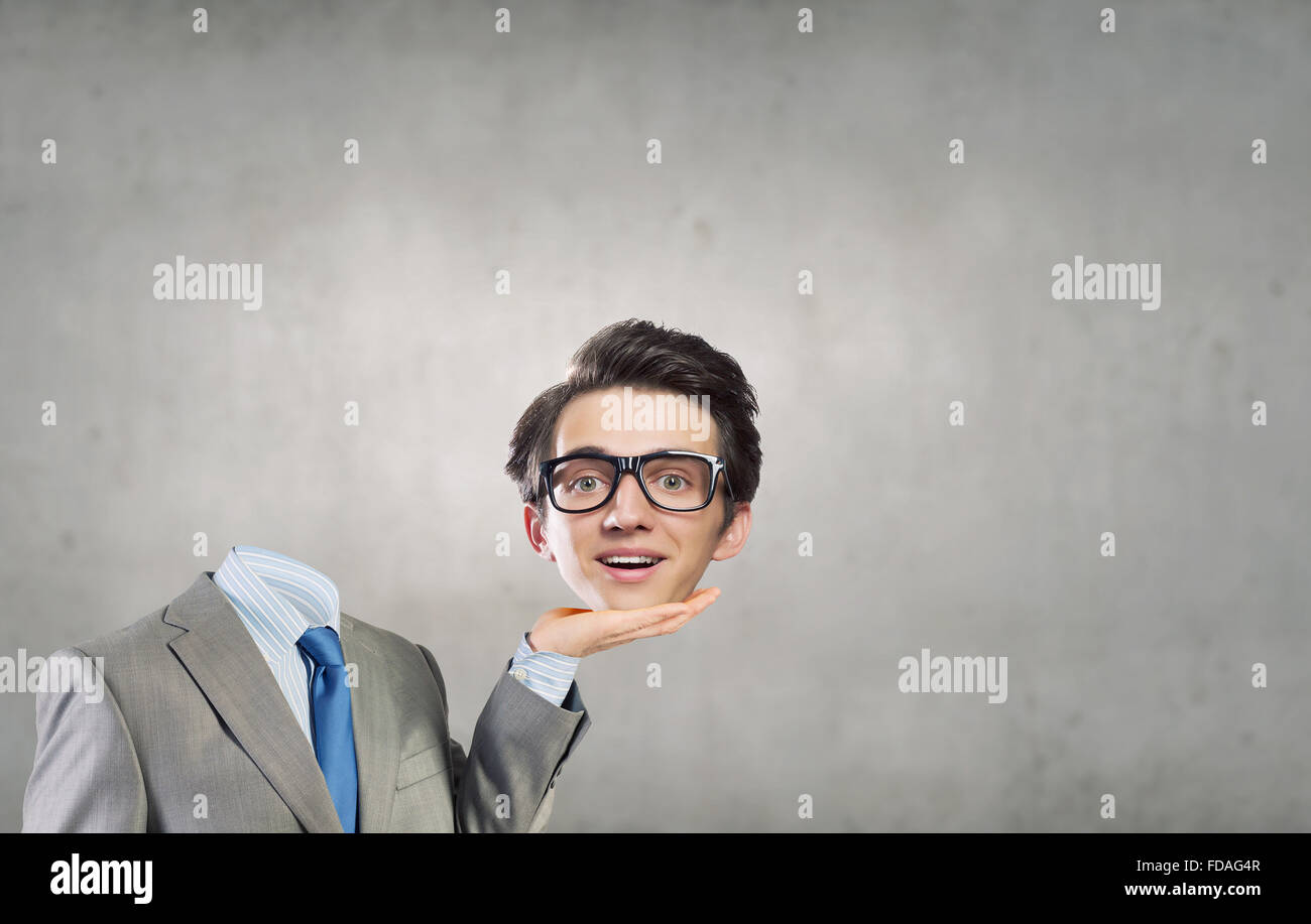 Young headless businesman holding his head in palm Stock Photo - Alamy