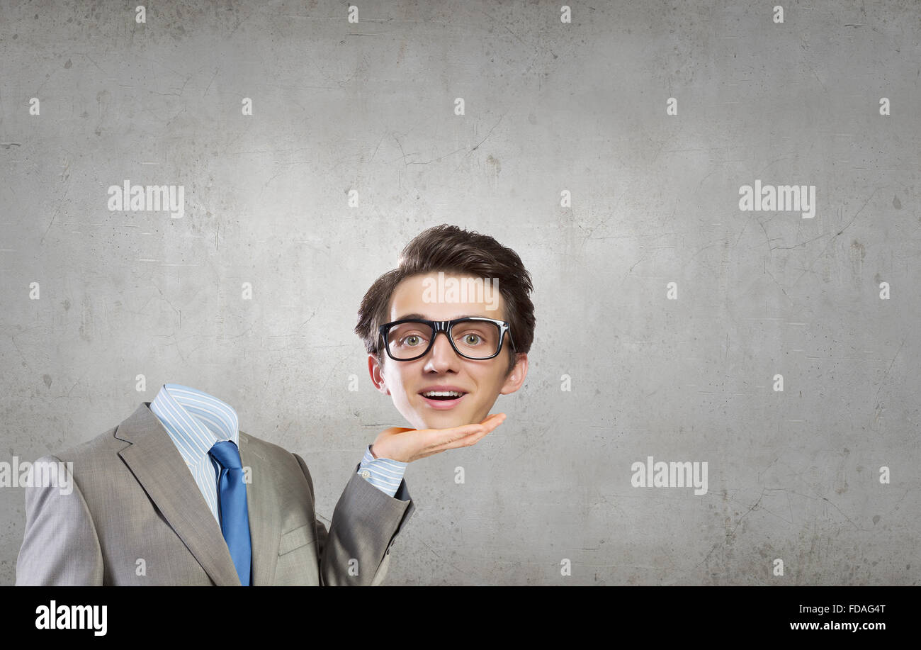 Young headless businesman holding his head in palm Stock Photo - Alamy