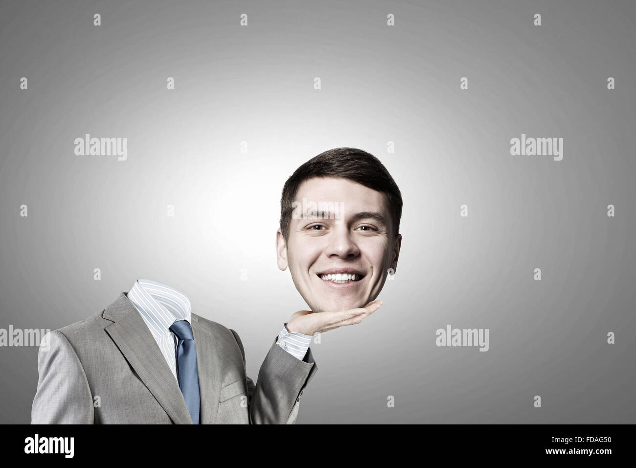 Young headless businesman holding his head in palm Stock Photo - Alamy