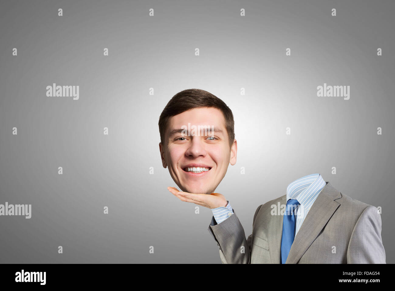 Young headless businesman holding his head in palm Stock Photo - Alamy