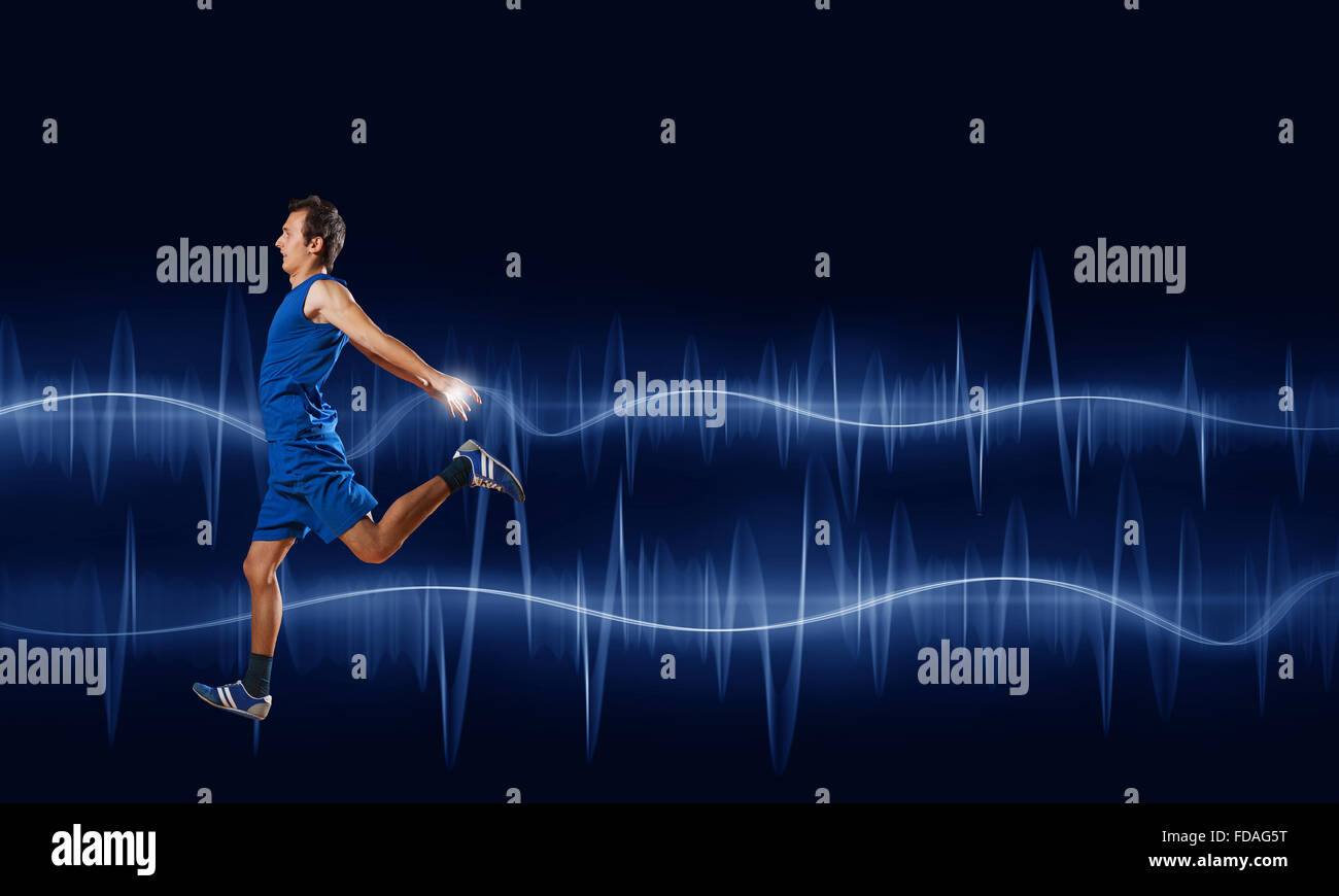 Running man in blue sport wear on black background Stock Photo - Alamy
