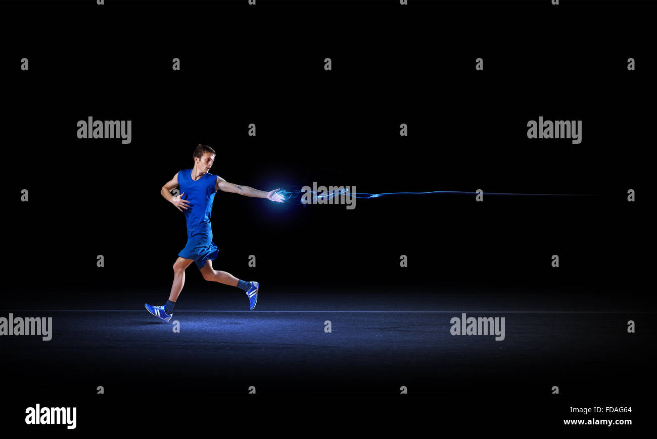 Young running man athlete in blue wear hi-res stock photography and ...