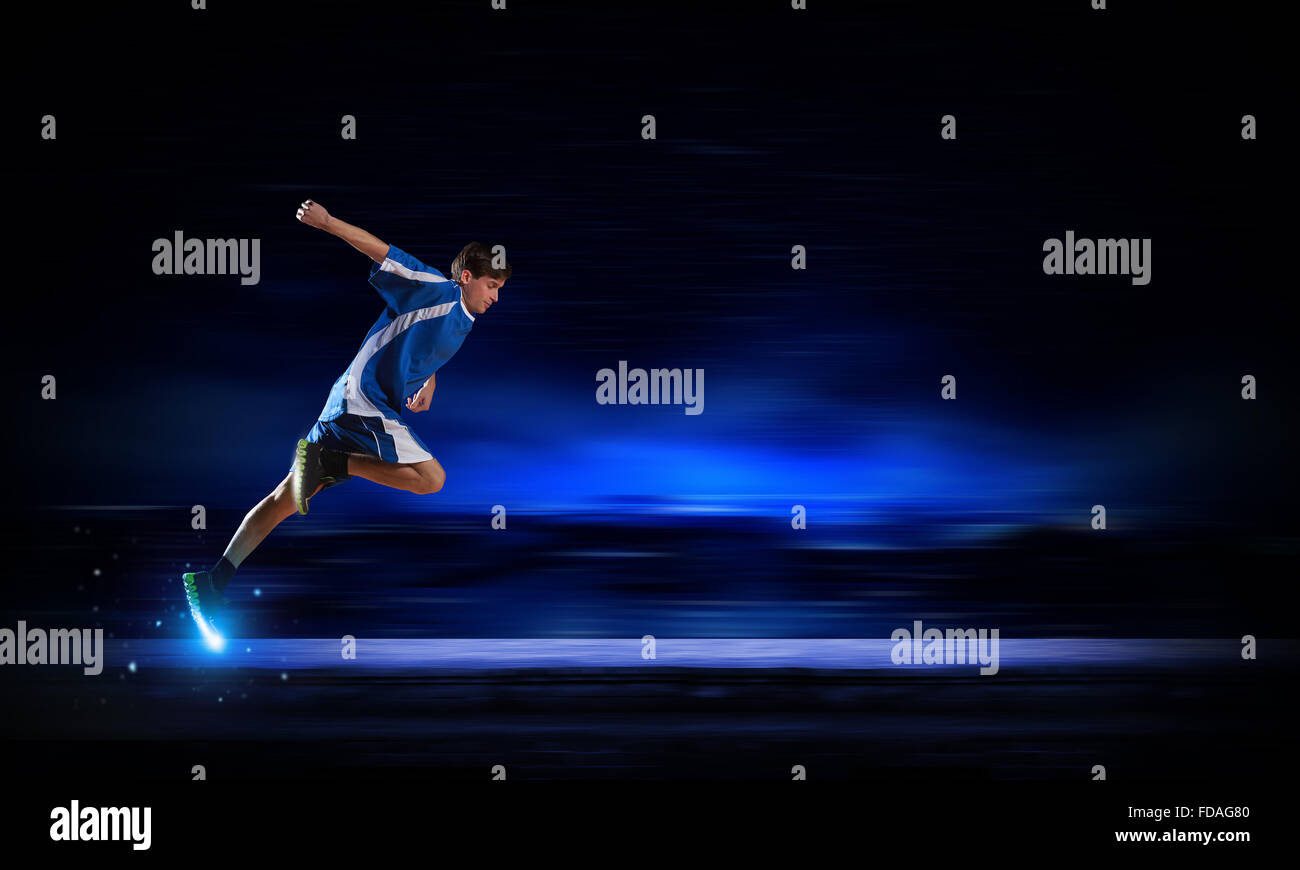 Running man in blue sport wear on black background Stock Photo - Alamy