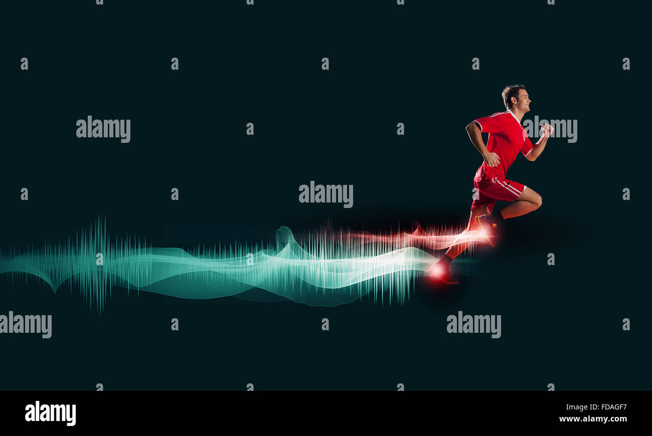 Running man in red sport wear on green background Stock Photo - Alamy