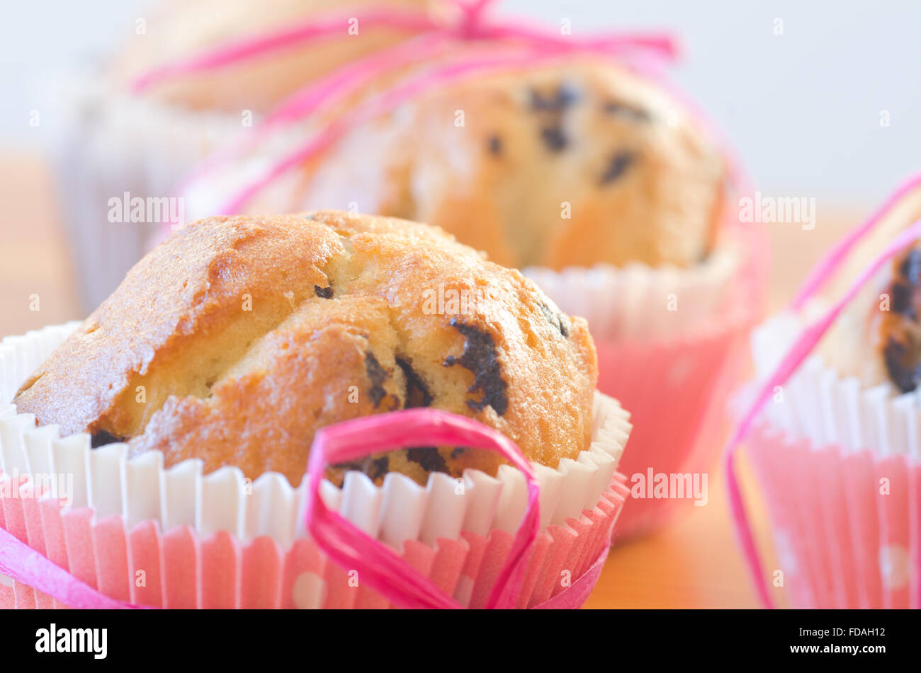 fresh muffins with pink decorations Stock Photo - Alamy