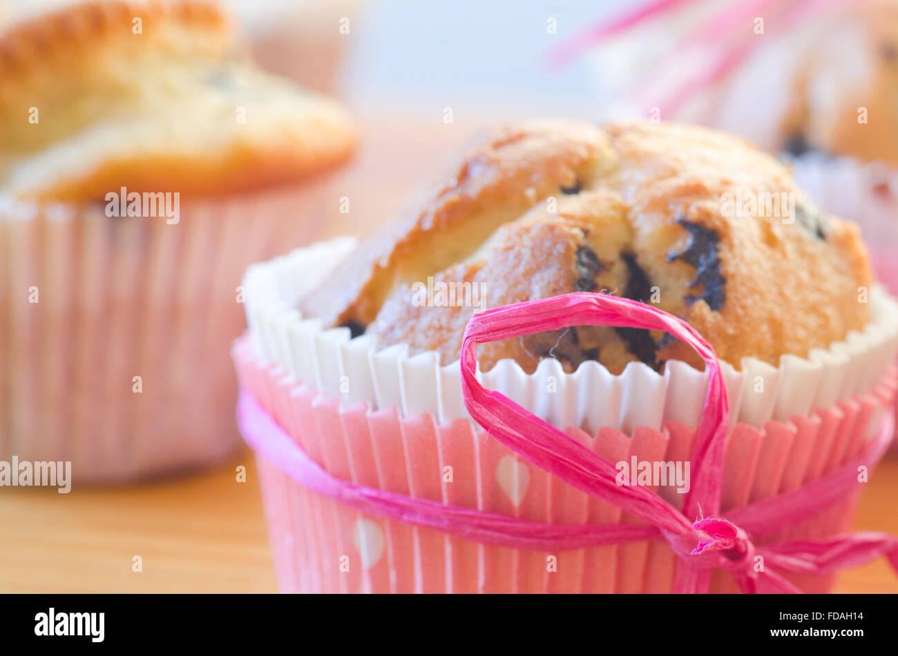 fresh muffins with pink decorations Stock Photo - Alamy