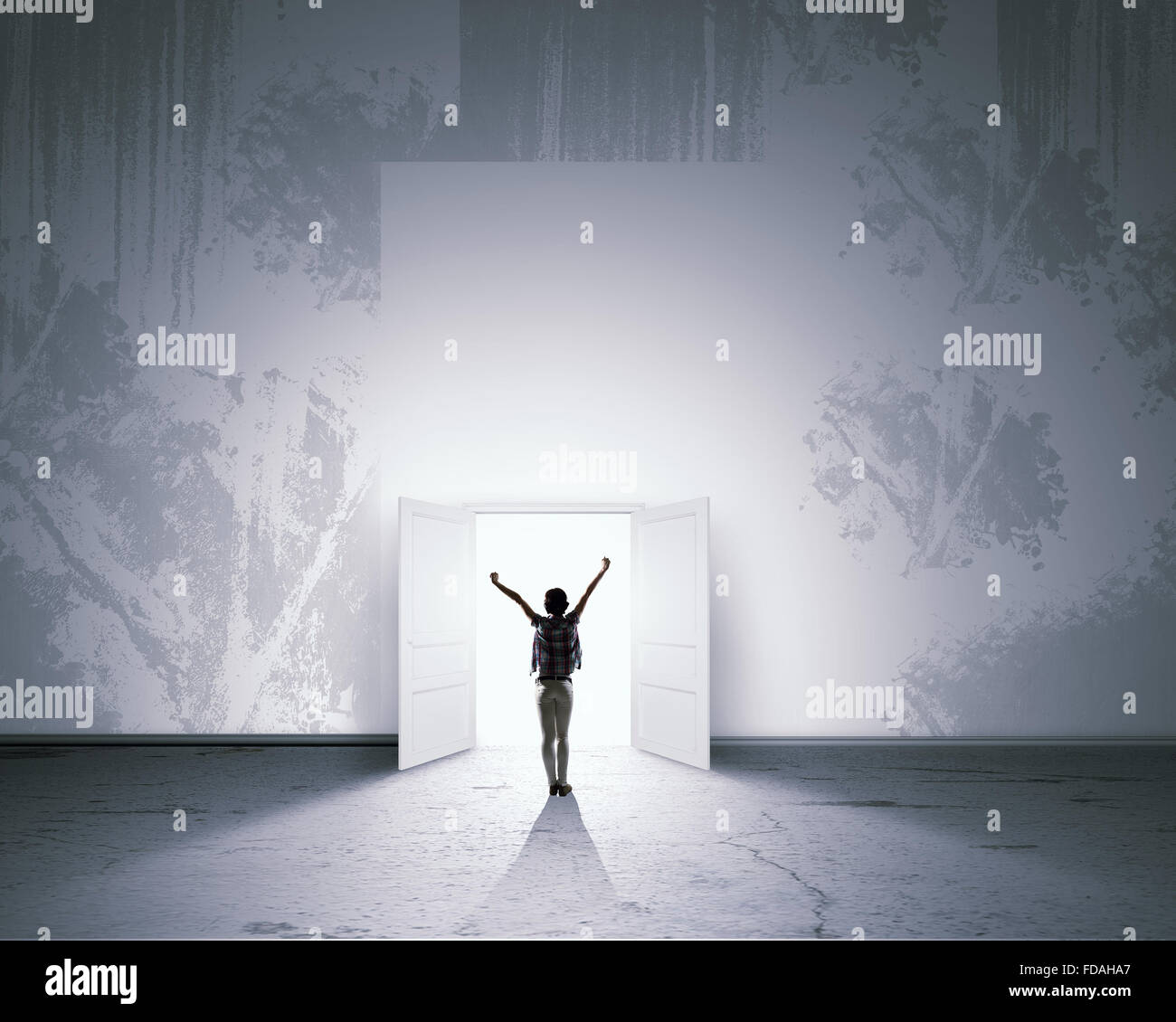 Rear view of woman with hands up entering opened door Stock Photo - Alamy