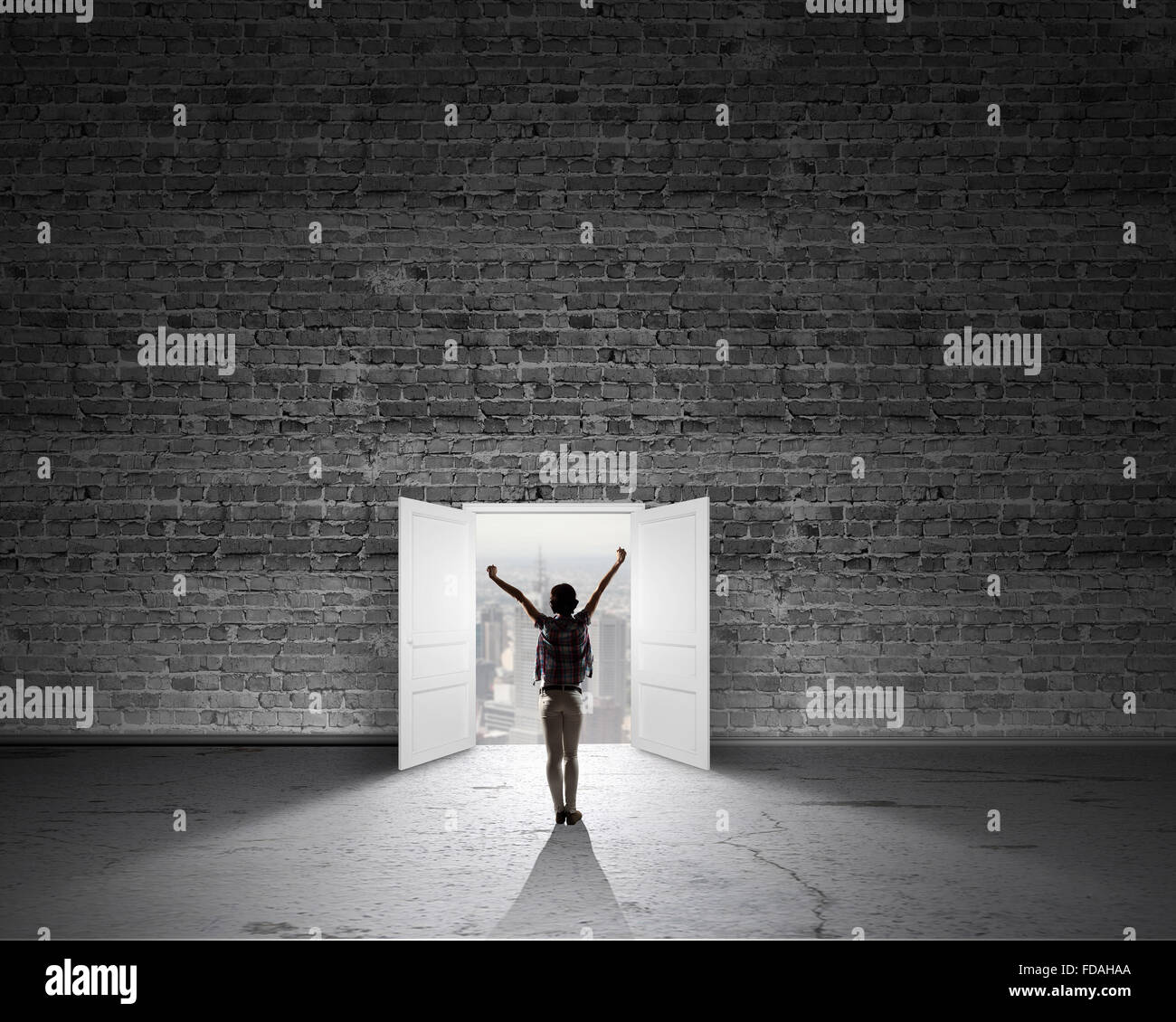 Rear view of woman with hands up entering opened door Stock Photo - Alamy