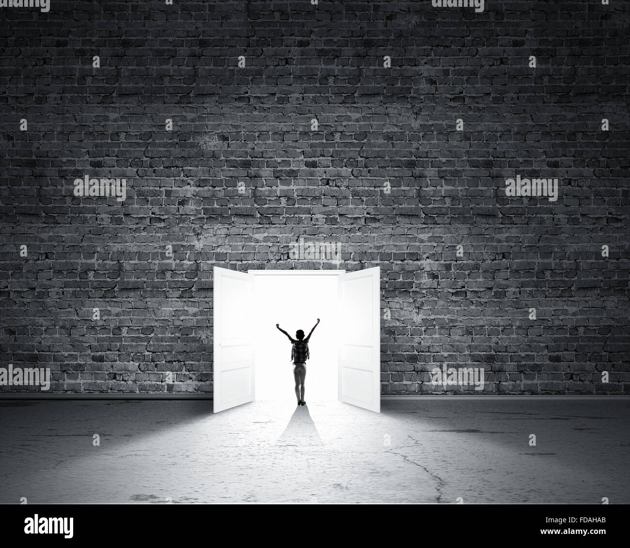 Rear view of woman with hands up entering opened door Stock Photo - Alamy