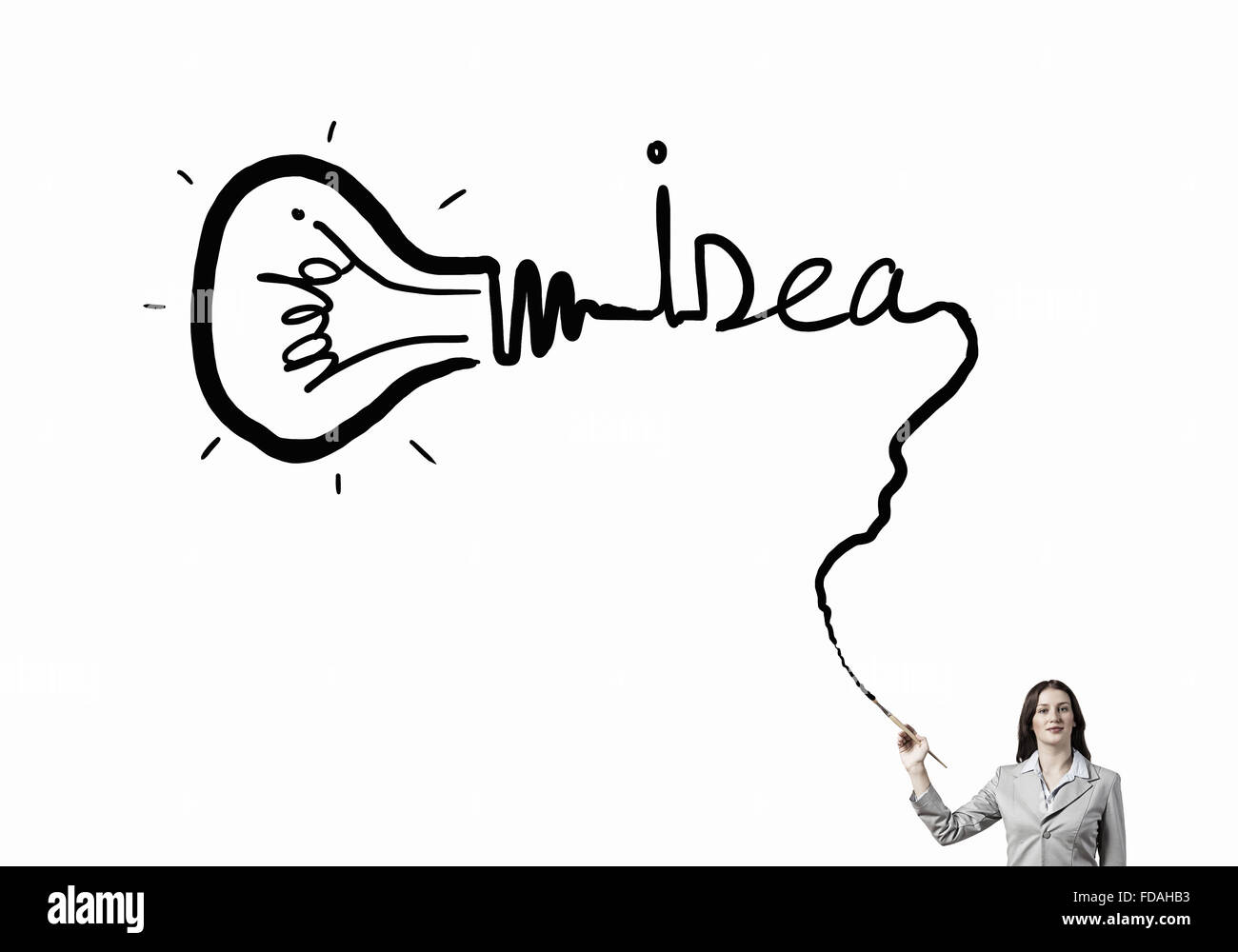 Young pretty businesswoman holding paint brush. Creativity concept ...