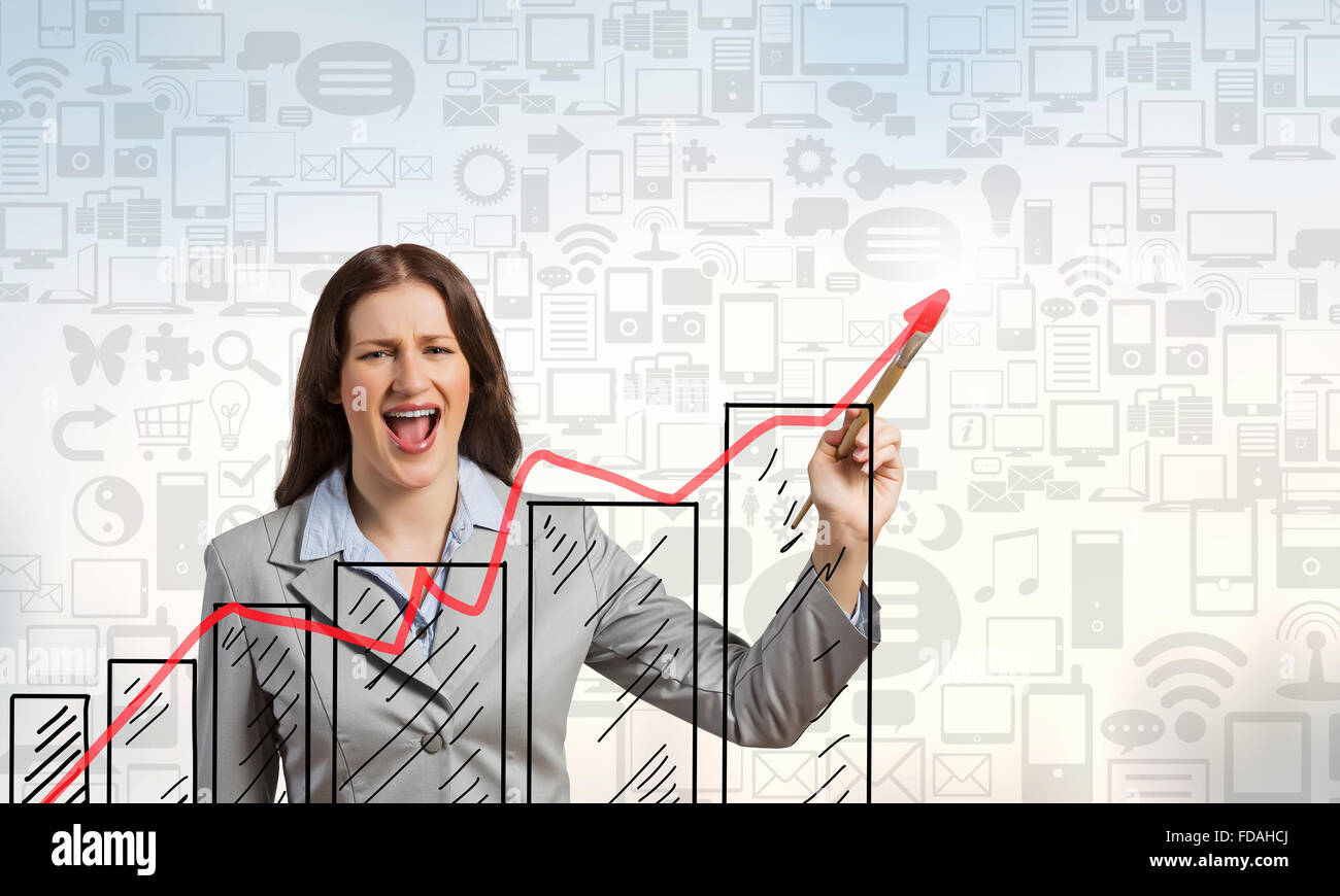 Young businesswoman drawing increasing graph with paint brush Stock ...