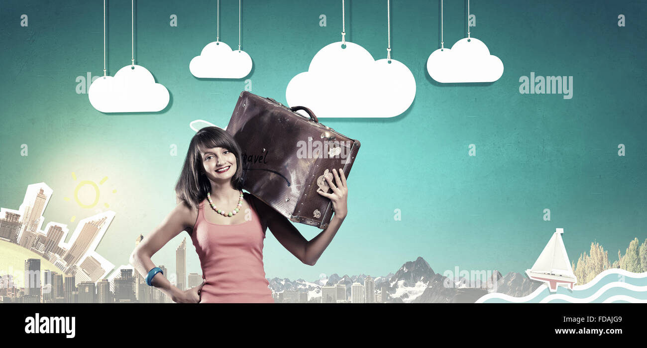 Young retro woman with her vintage baggage on shoulder Stock Photo - Alamy
