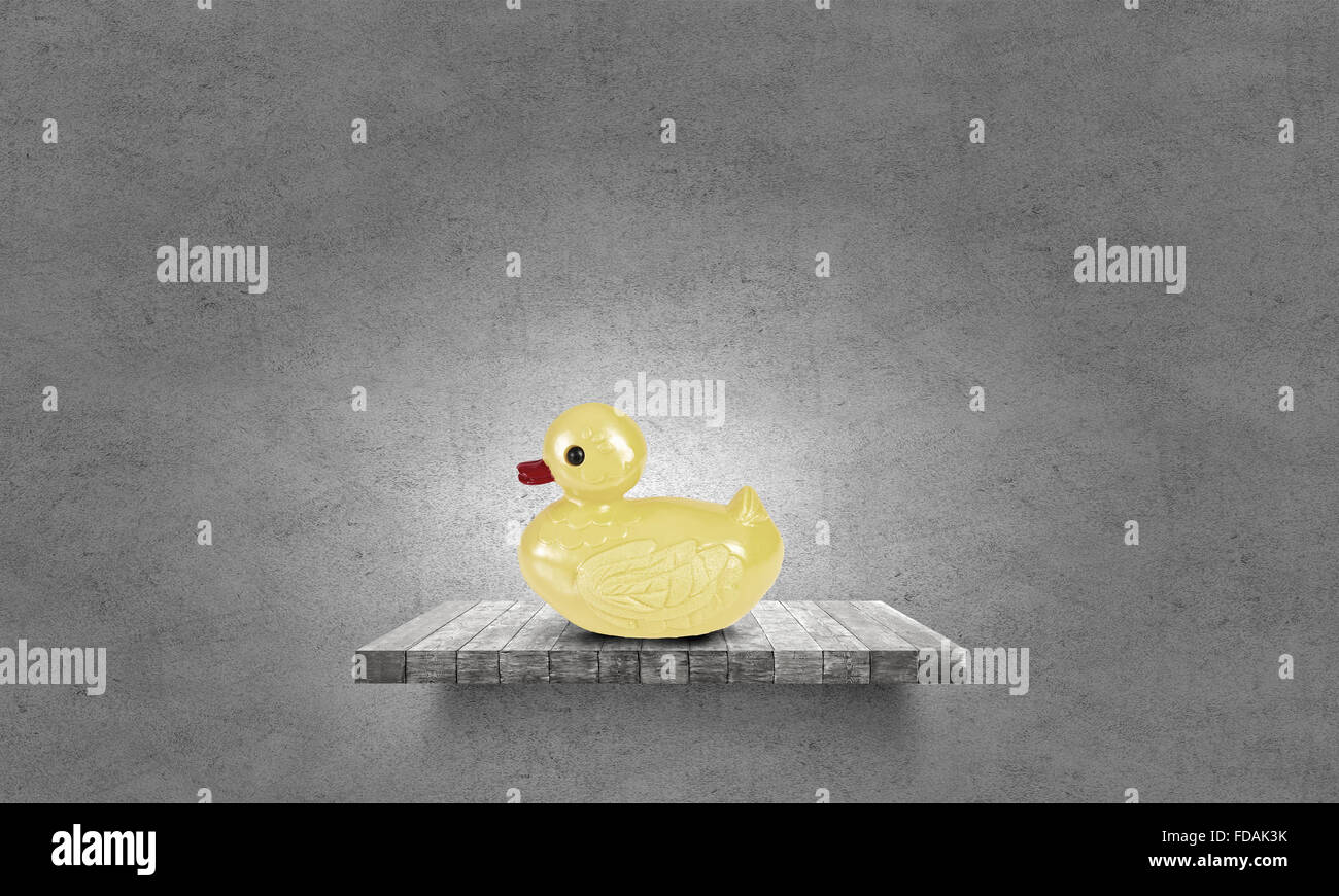 Yellow rubber duck toy on wooden board Stock Photo - Alamy