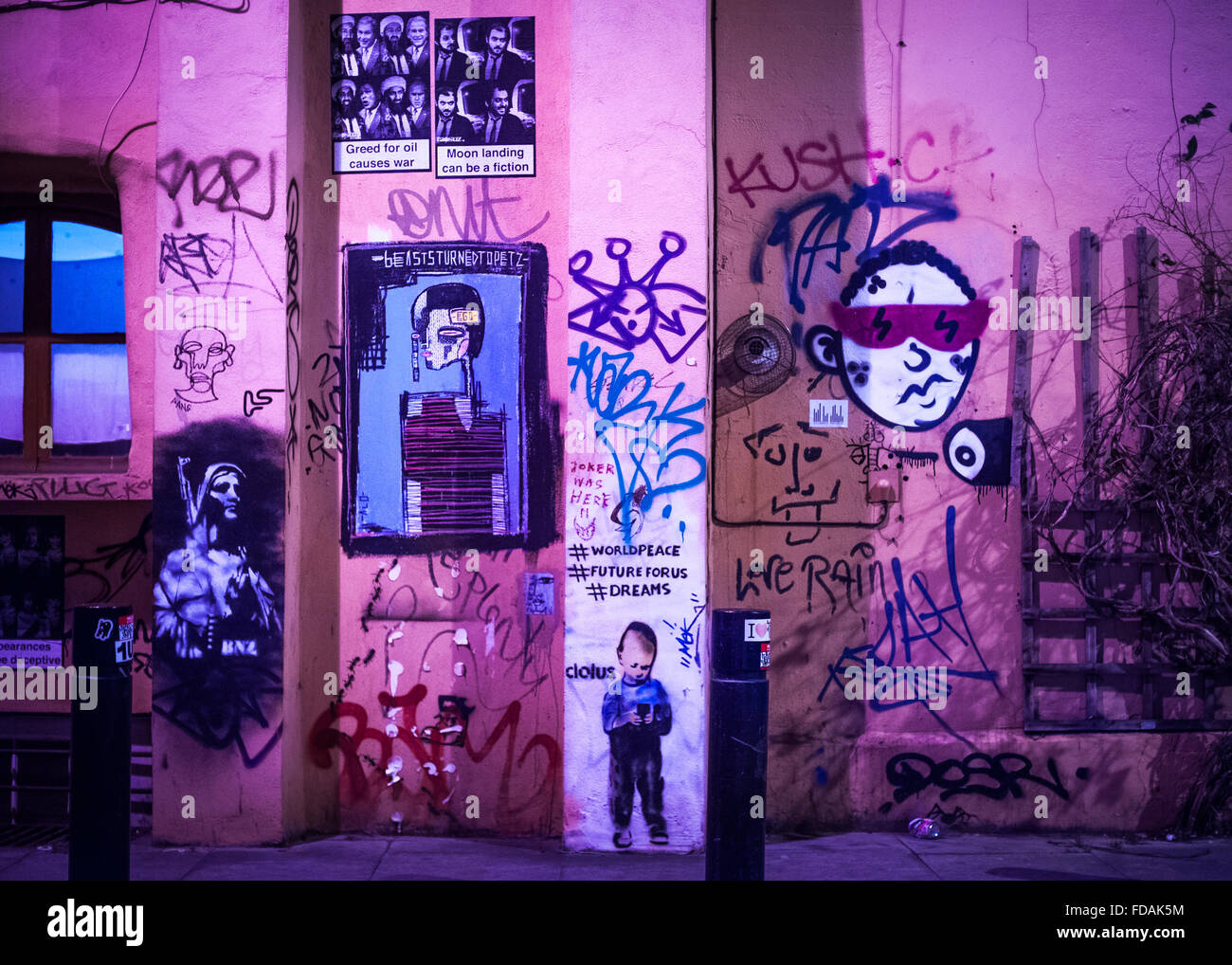 Avant garde street art and graffiti at night in trendy Shoreditch, East ...