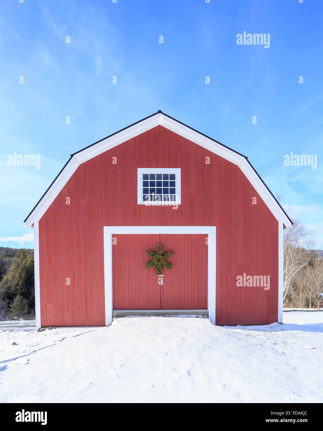 Front view of a brightly painted red traditional New England barn in ...