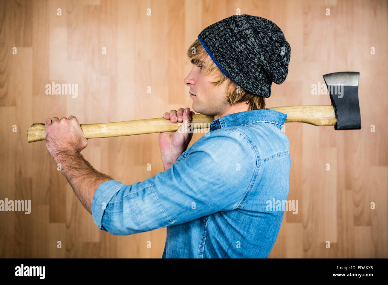 Side view of hipster standing with axe Stock Photo - Alamy
