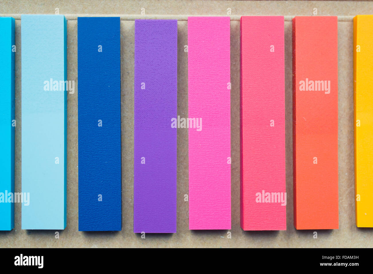 Strips of colorful paper as a background image Stock Photo - Alamy