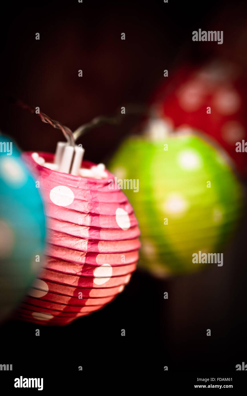 Decorative paper lanterns on a wire Stock Photo - Alamy