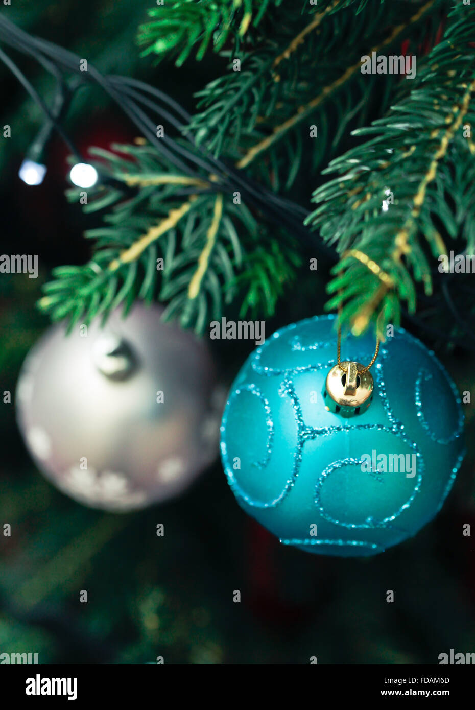 Festive decorations hanging on a tree Stock Photo - Alamy
