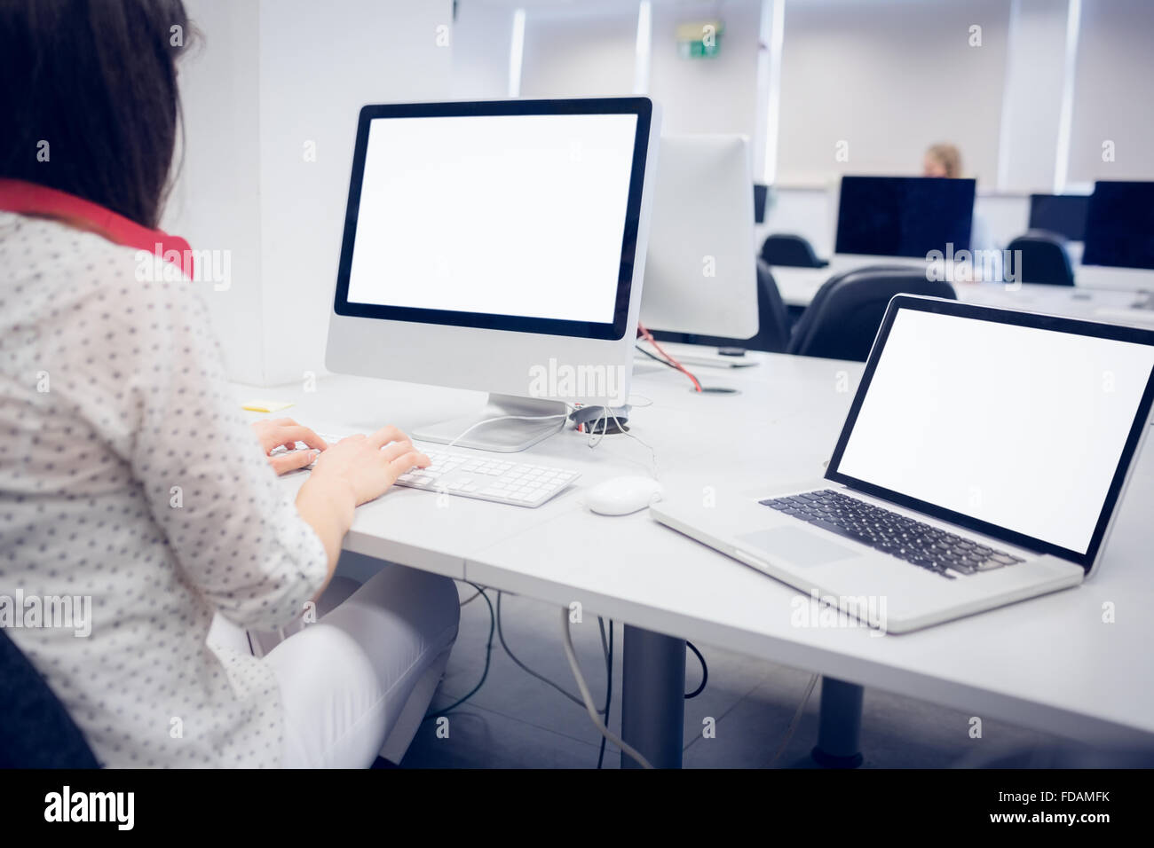 Rear view of student using computer Stock Photo - Alamy