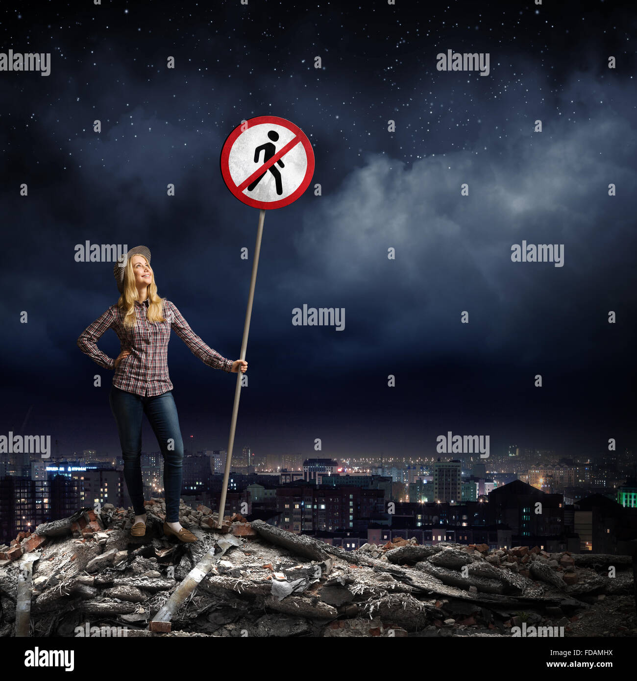 Young girl in casual holding stop sign Stock Photo - Alamy