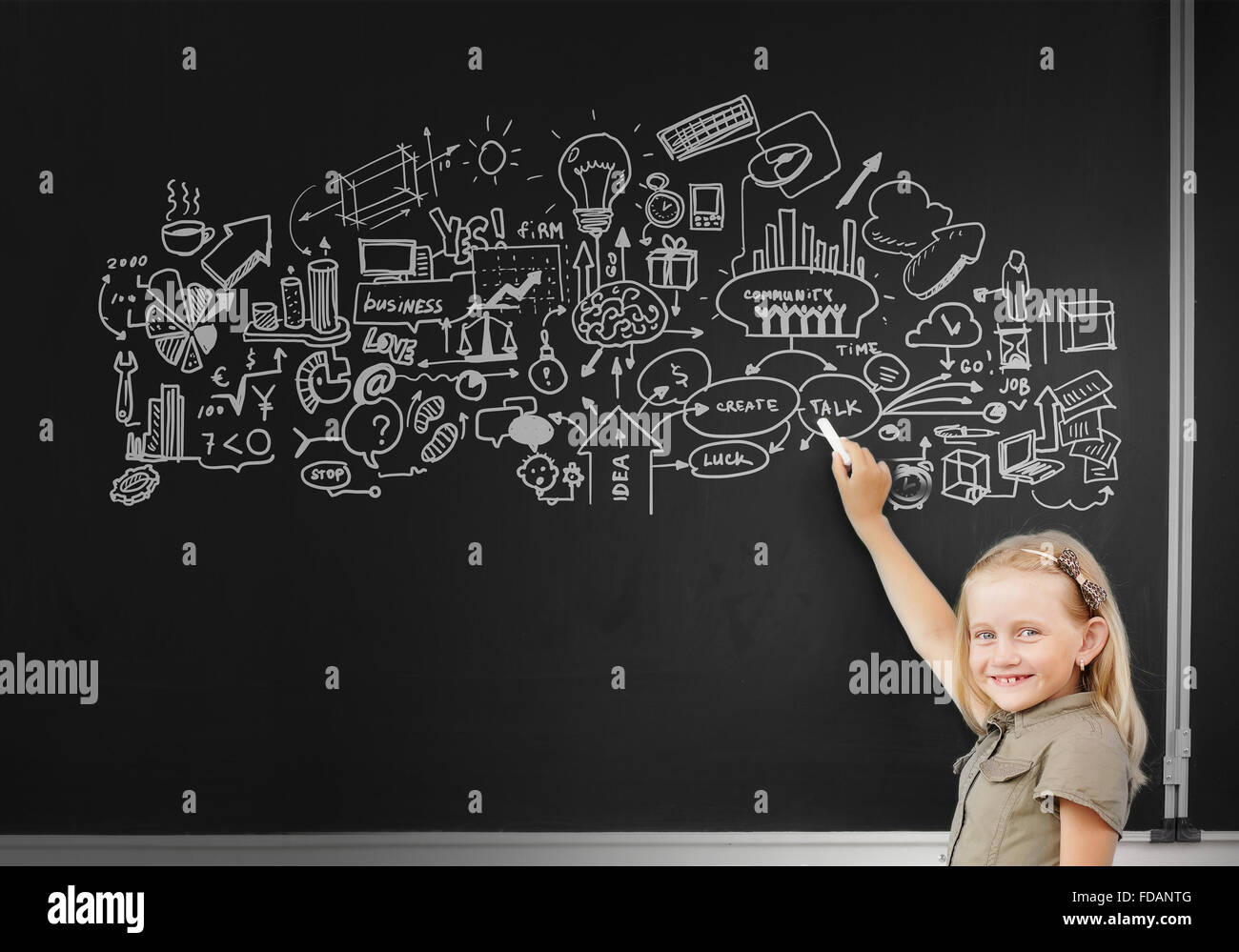 School girl writing chalk sketches on blackboard Stock Photo - Alamy