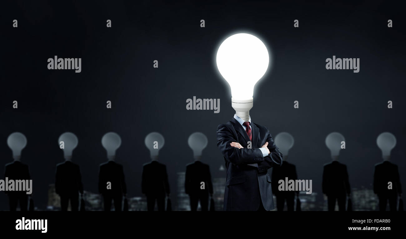 Businessman in suit with light bulb instead of head Stock Photo - Alamy