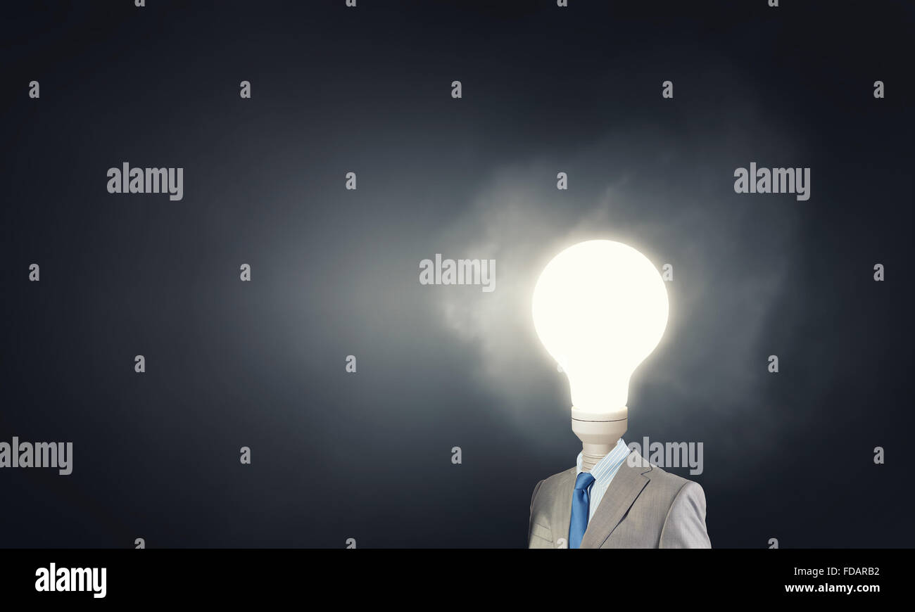 Businessman in suit with light bulb instead of head Stock Photo - Alamy
