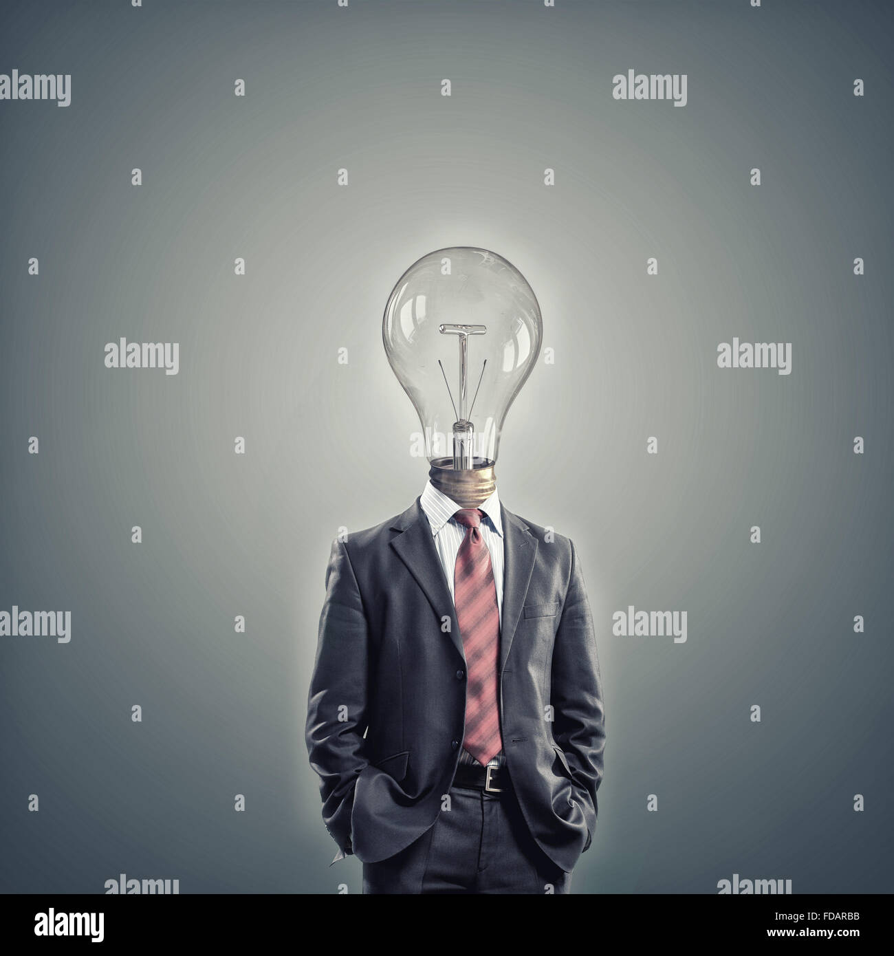 Businessman in suit with light bulb instead of head Stock Photo - Alamy