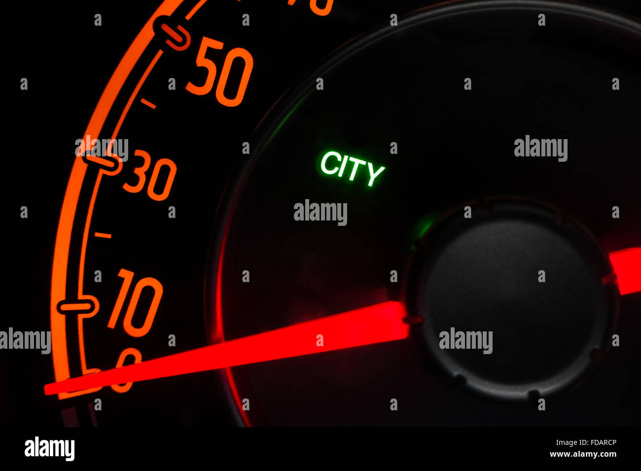 city alert light on speedometer Stock Photo - Alamy