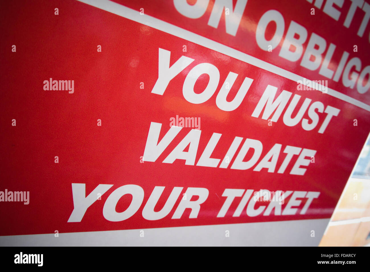 you must validate your ticket on city bus Stock Photo - Alamy